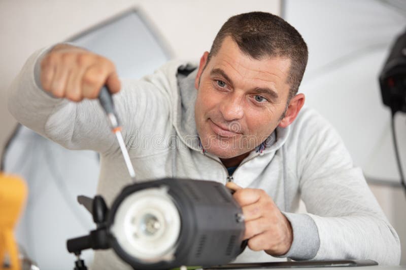 Photographer Soldering Wireless Flash Trigger at Workplace Stock Image ...