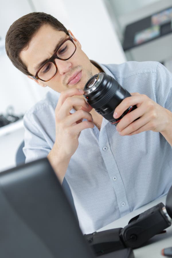 Photographer Soldering Wireless Flash Trigger at Workplace Stock Image ...