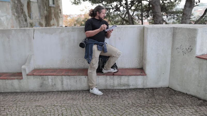 Photographer Taking Notes on Location Stock Video - Video of outdoors ...