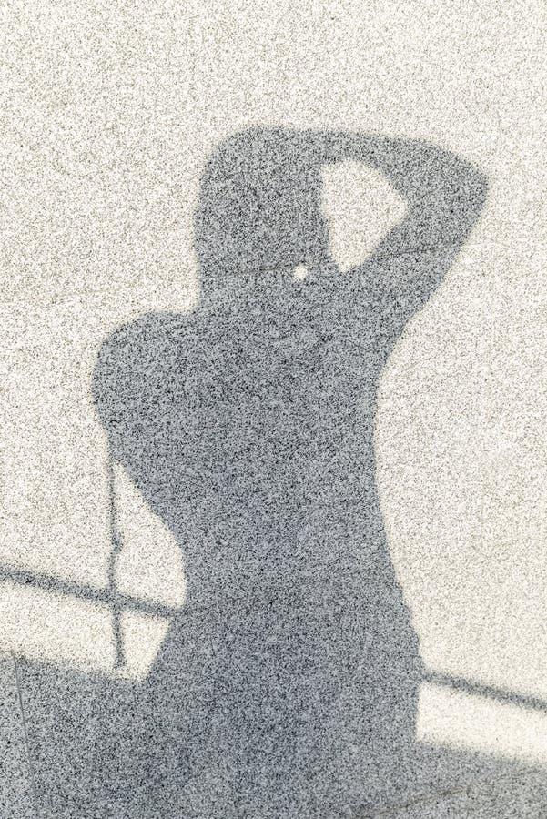 Photographer Taking a Photo Casting Shadows on a Concrete Wall Stock ...