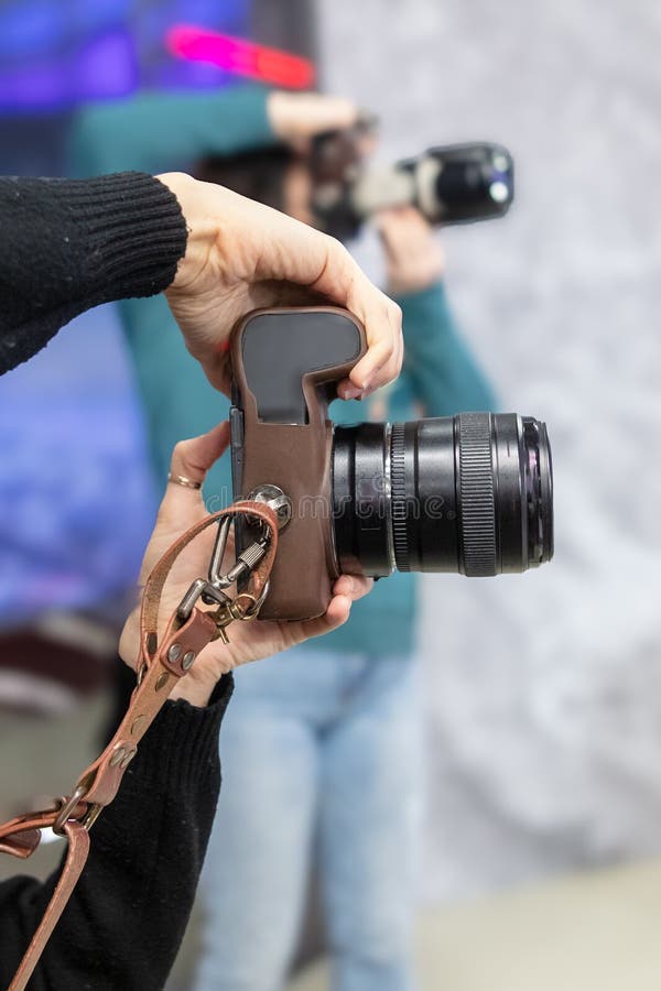 Photographer Taking Photo of a Young Man in Front of the Camera Stock ...