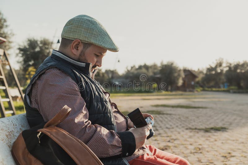 Photographer Taking a Rest at the Park Bench Stock Photo - Image of ...