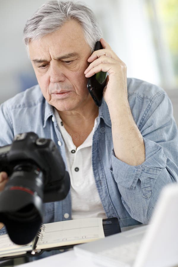 Photographer Talking on Phone Stock Photo - Image of reporter ...