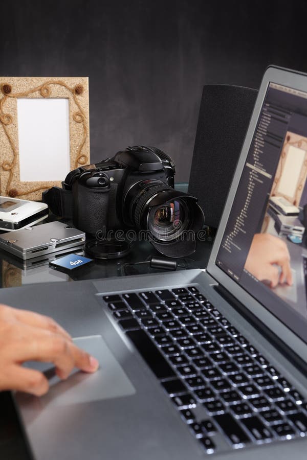 Photographer using laptop stock photo. Image of camera - 16061960