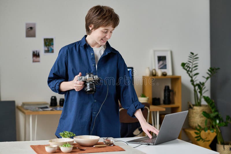 Photographer Using Laptop at Her Work Stock Photo - Image of camera ...