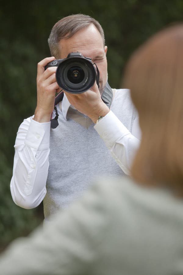 Photographer at work stock image. Image of woman, smiling - 10900013