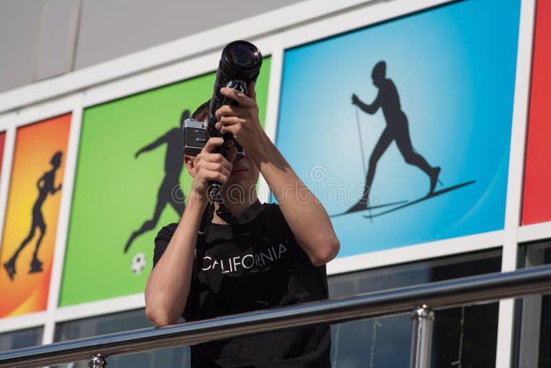 The Photographer at Work, the Photographer Checks the Footage, the ...