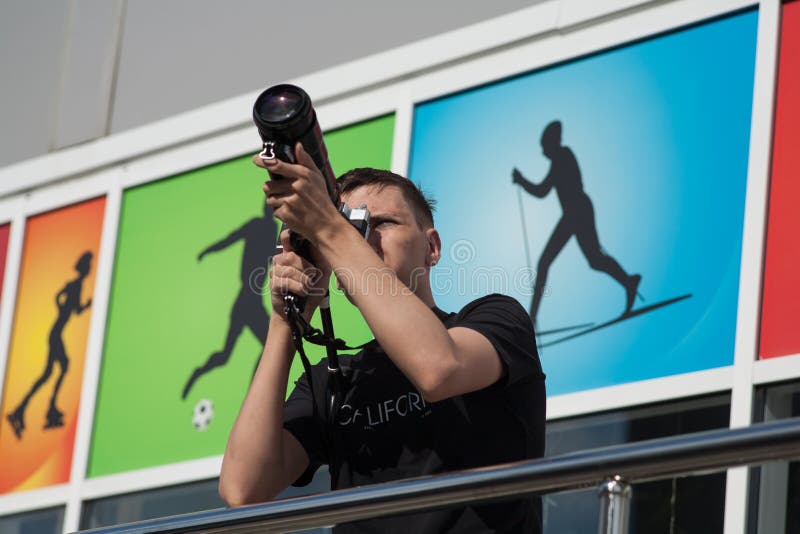 The Photographer at Work, the Photographer Checks the Footage, the ...