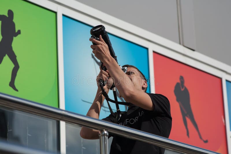 The Photographer at Work, the Photographer Checks the Footage, the ...