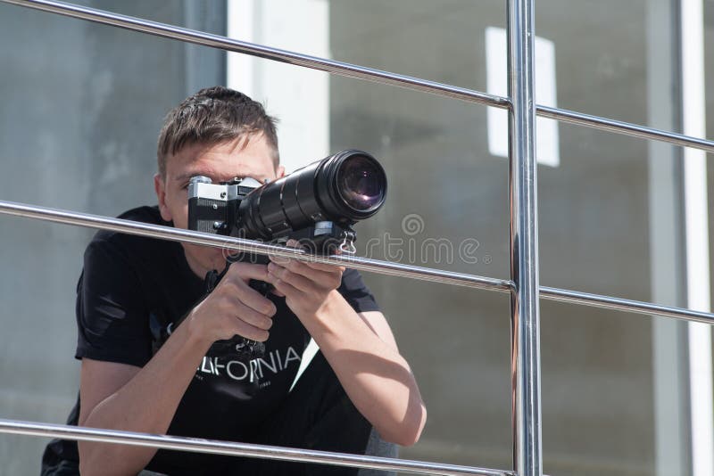 The Photographer at Work, the Photographer Checks the Footage, the ...