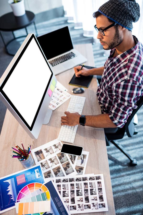 Photographer Working at Computer Desk Stock Photo - Image of office ...