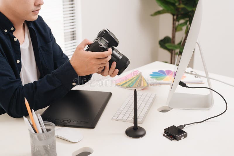 Photographer Working at Desk in Modern Office Stock Photo - Image of ...