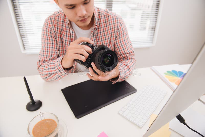 Photographer Working at Desk in Modern Office Stock Photo - Image of ...
