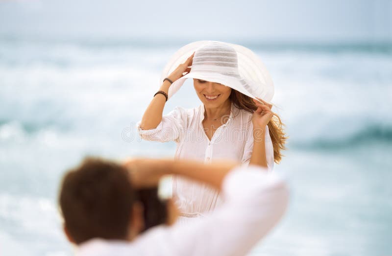 Photographer Working with a Model on the Beach Stock Photo - Image of ...