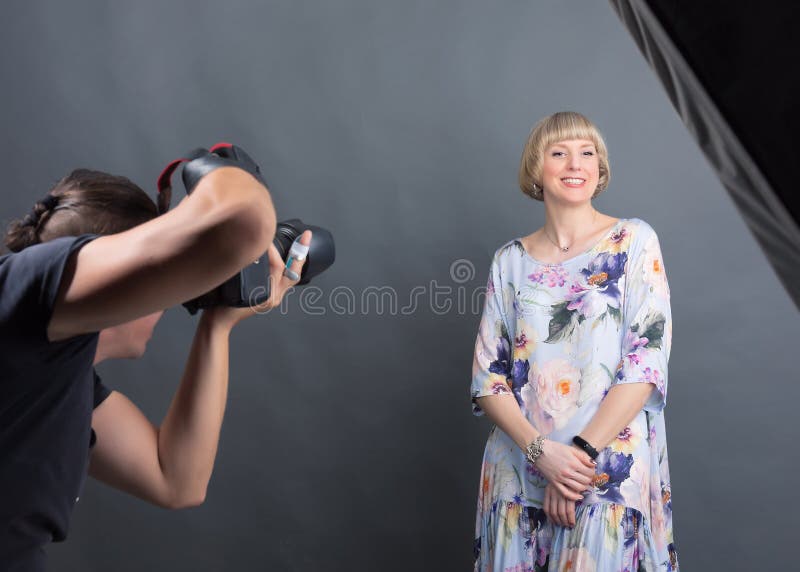 Photographer Works with a Client in the Studio Stock Photo - Image of ...