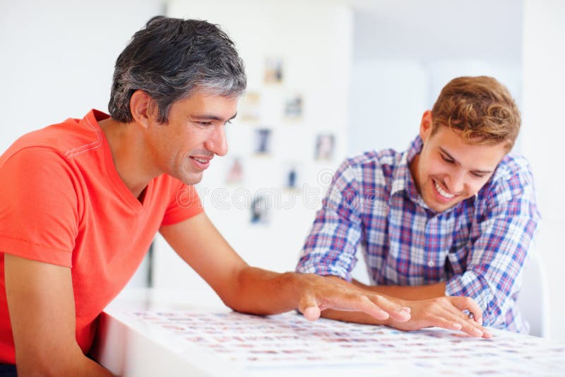 Photographers Discussing. Photographers Checking Out Their Photos and ...