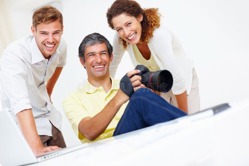 Photographers Smiling. Portrait of Three Professional Photographers ...