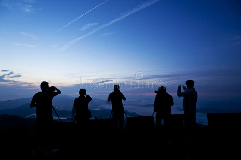 Photographers Waiting for the Sunrise on a Mountain Peak Stock Photo ... Photographers Waiting for the Sunrise on a Mountain Peak Stock Photo ...