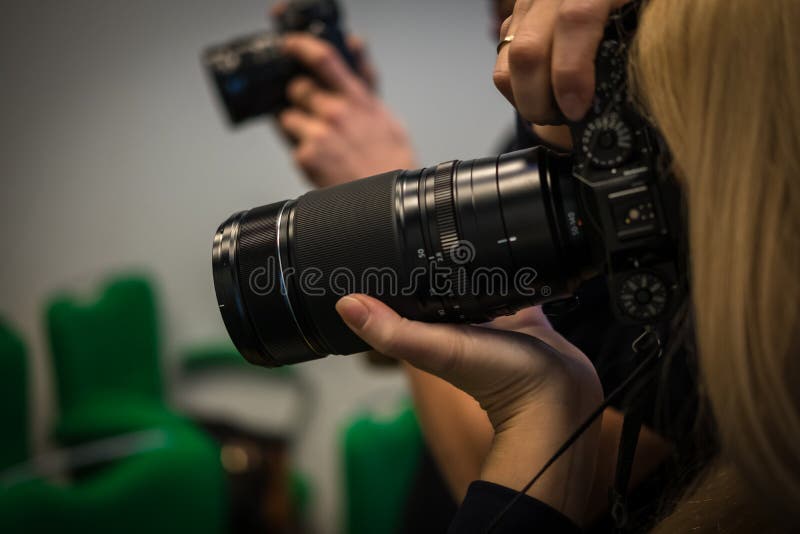 Photographers at work editorial stock photo. Image of green - 82663983