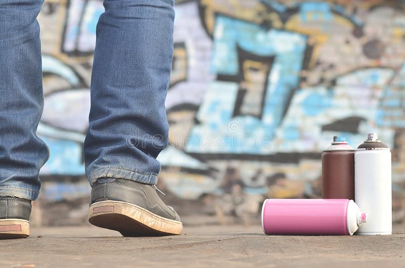 A Still-life of Several Used Paint Cans of Different Colors Agai Stock ...