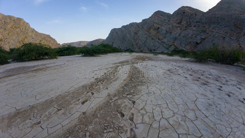 Photography of Dried Up Riverbed with Mud and Tyre Tracks in Oman ...