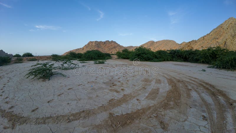 Photography of Dried Up Riverbed with Mud and Tyre Tracks in Oman ...