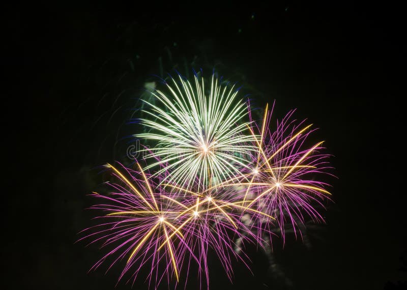 A Photography of a Fireworks Display with Multiple Colors and a Black ...