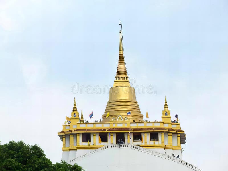A Photography of a Large White Building with a Gold Spire, There is a ...