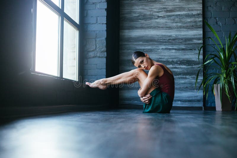 Modern Ballet Dancer Performing Ballet Exercise on Dark Studio ...