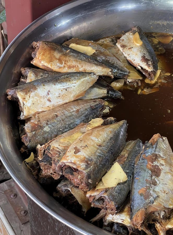 A Photography of a Pan Filled with Fish and Sauce on a Table, Hot Pot ...
