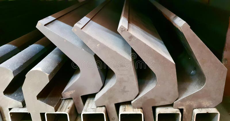 A Photography of a Stack of Steel Bars Stacked on Top of Each Other ...