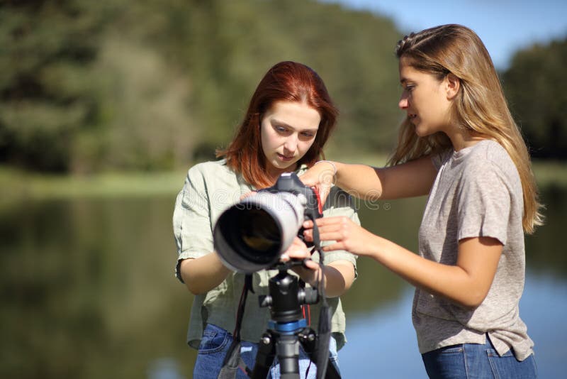 Photography Teacher Teaching How To Use a Camera Stock Image - Image of ...