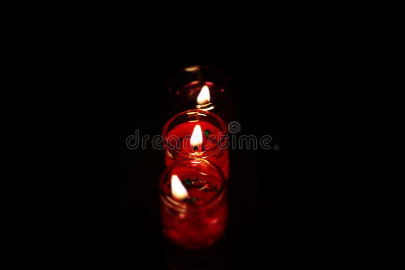 Photography Three Tealight Candles In Dark Place Picture. Image: 115013032
