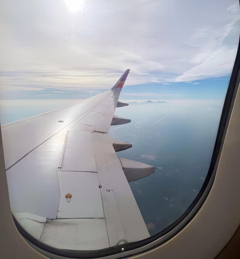 A Photography of a View of the Wing of an Airplane from the Window ...