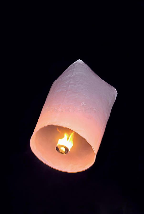 A Photography of a White Paper Lantern with a Lit Candle Inside, There ...