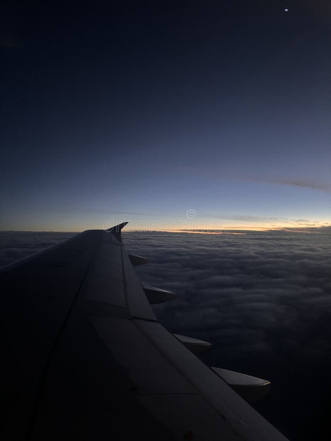Dawn View on a Plane stock image. Image of sunlight - 342132655