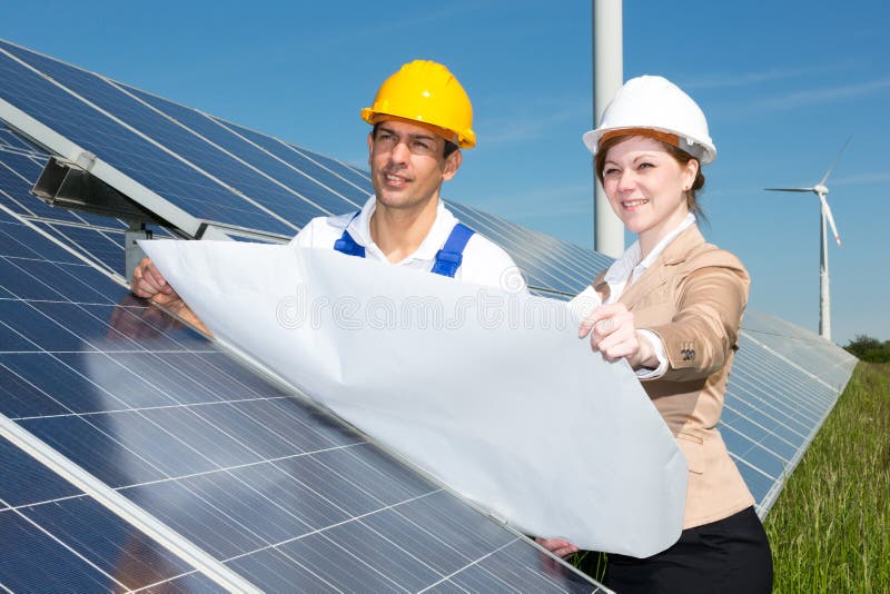 Photovoltaic Engineers with Construction Plan at Solar Panels Stock ...