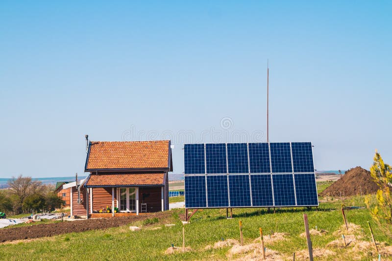 Photovoltaic Modules and a House in the Village Stock Image - Image of ...