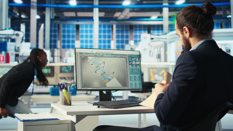 Photovoltaics Factory Engineer Looking Over Paperwork Documents ...