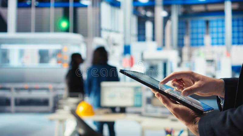 Photovoltaics Factory Worker Uses Tracking Software on Tablet To ...