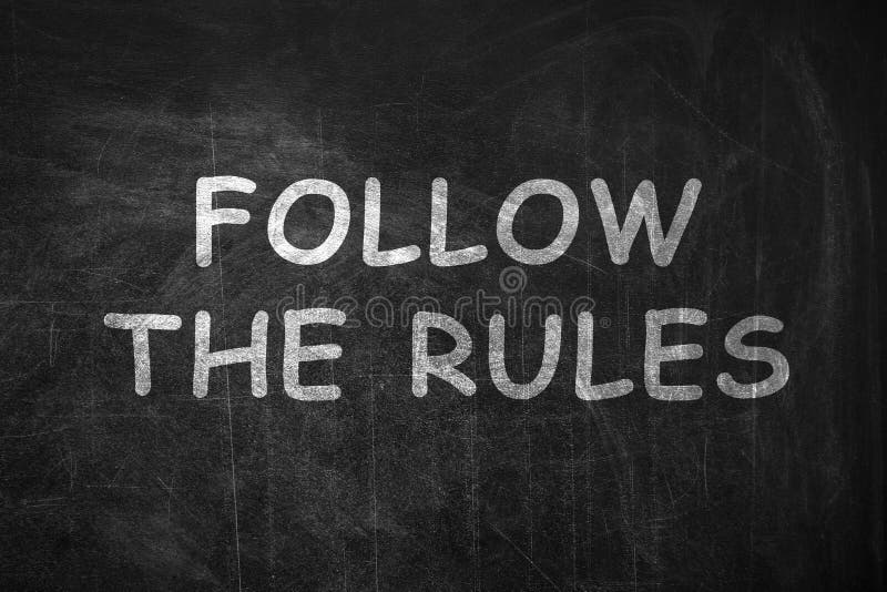 Phrase Follow the Rules Written with Chalk on Blackboard Stock Photo ...