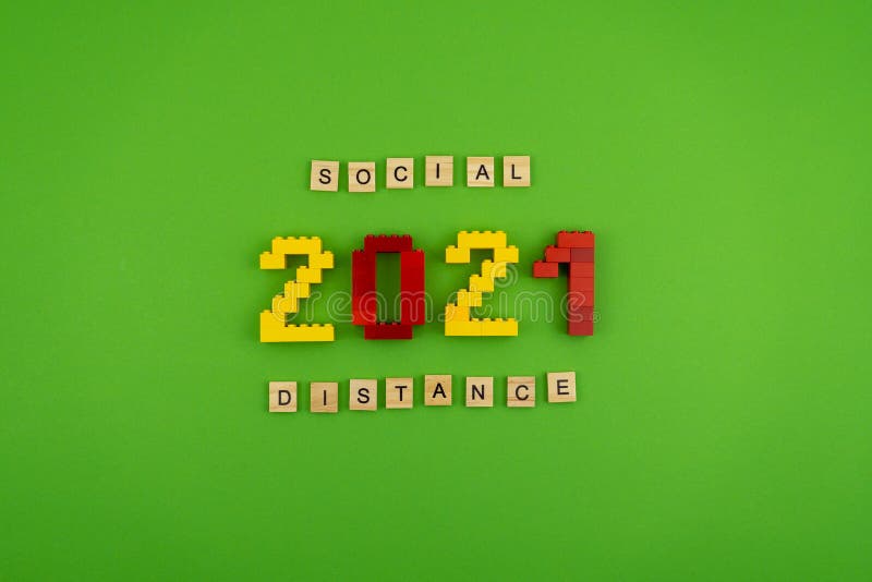 The Phrase Social Distance 2021 is Lined with Wooden Letters on a Green ...