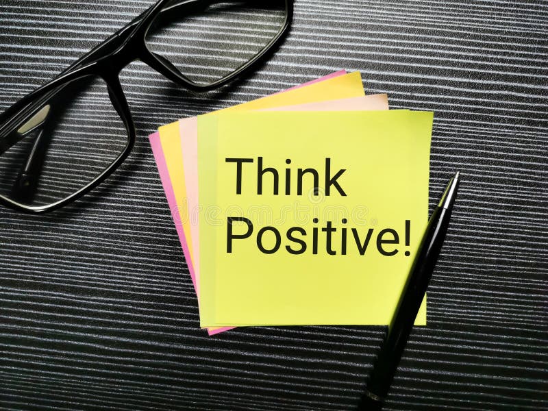 Phrase Think Positive Written on Sticky Note with a Pen and Eye Glasses ...