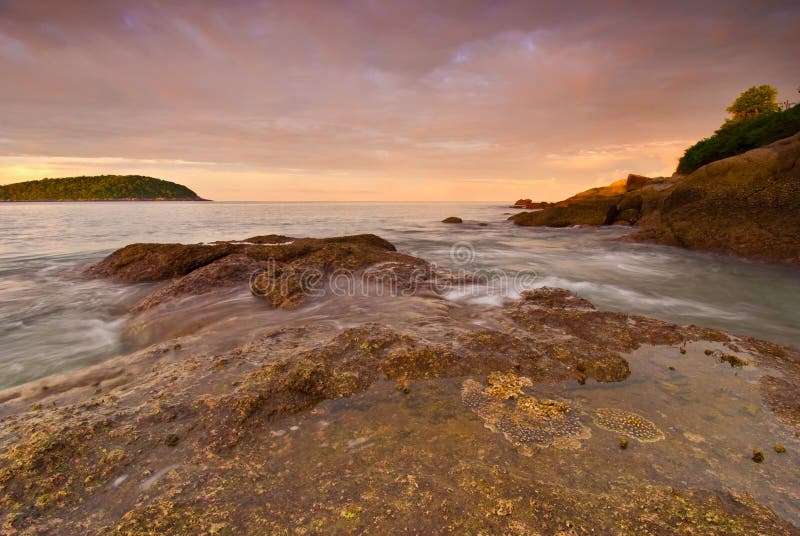 Phuket Beach at Sunrise with Interesting Rocks in Foreground Stock ...