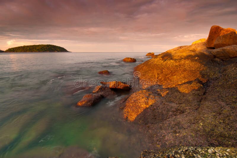 Phuket Beach at Sunrise with Interesting Rocks in Foreground Stock ...