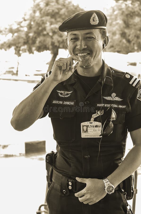 Phuket, Thailand - 2009: Thai Airport Security Guard Smoking during ...