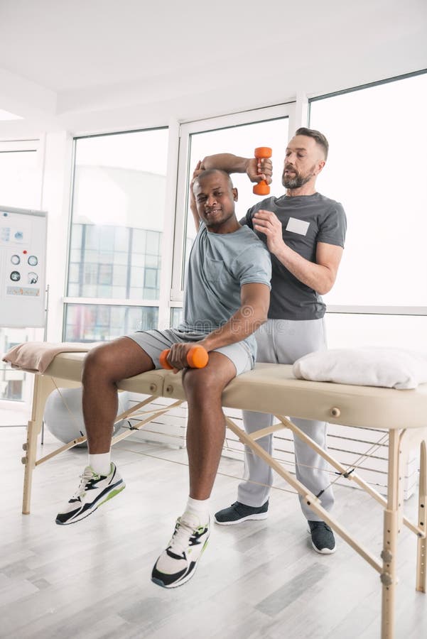 Delighted Young Man Doing a Workout Stock Photo - Image of coach ...