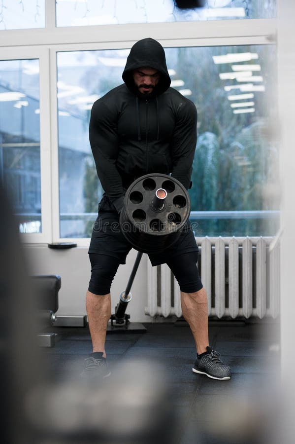 Physical Development of Young Strong Man Pulling Heavy Weight Barbell ...