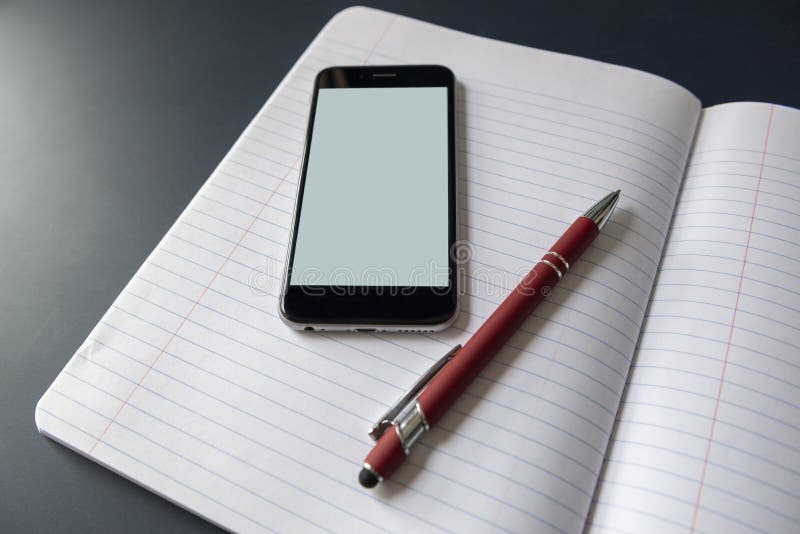 A Physical Notepad with a Pen and a Smart Phone Stock Image - Image of ...