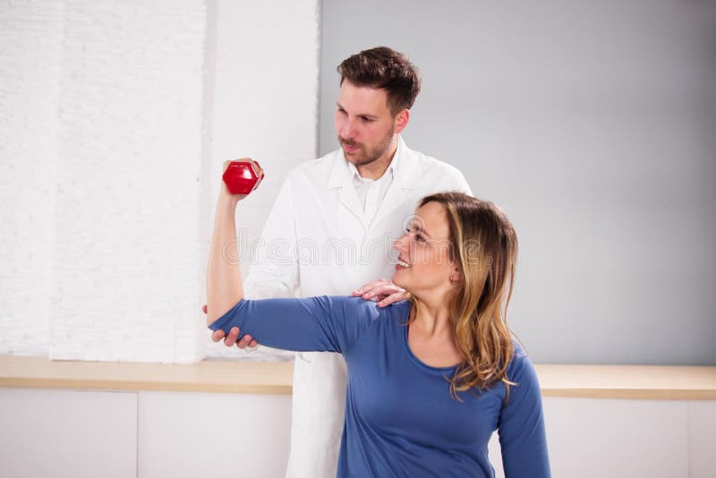 Physical Rehabilitation Therapist Helping Man Stock Image - Image of ...